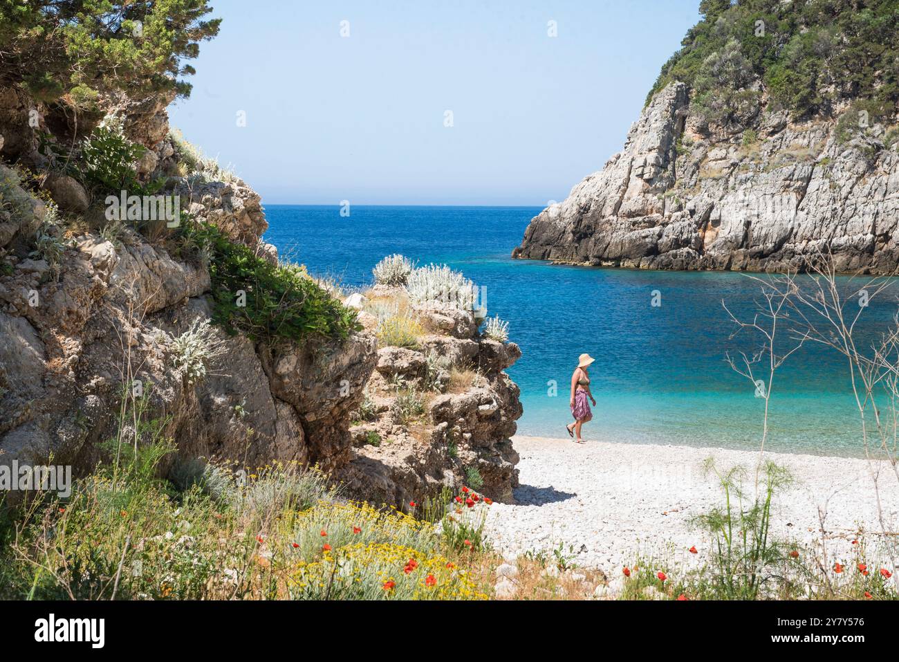 Woman walking on the Beach of Dafines bay, Peninsula of Karaburun ...