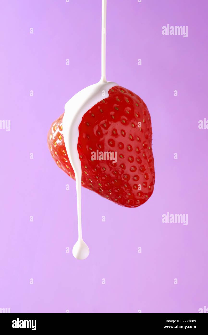 Free-floating strawberry with cream Stock Photo - Alamy