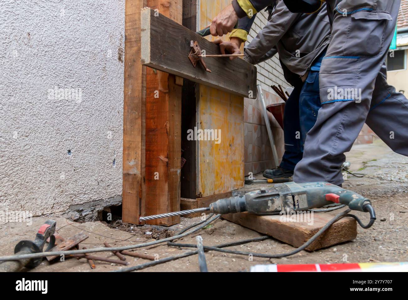 Worker is installing and assembling column formworks for concrete ...