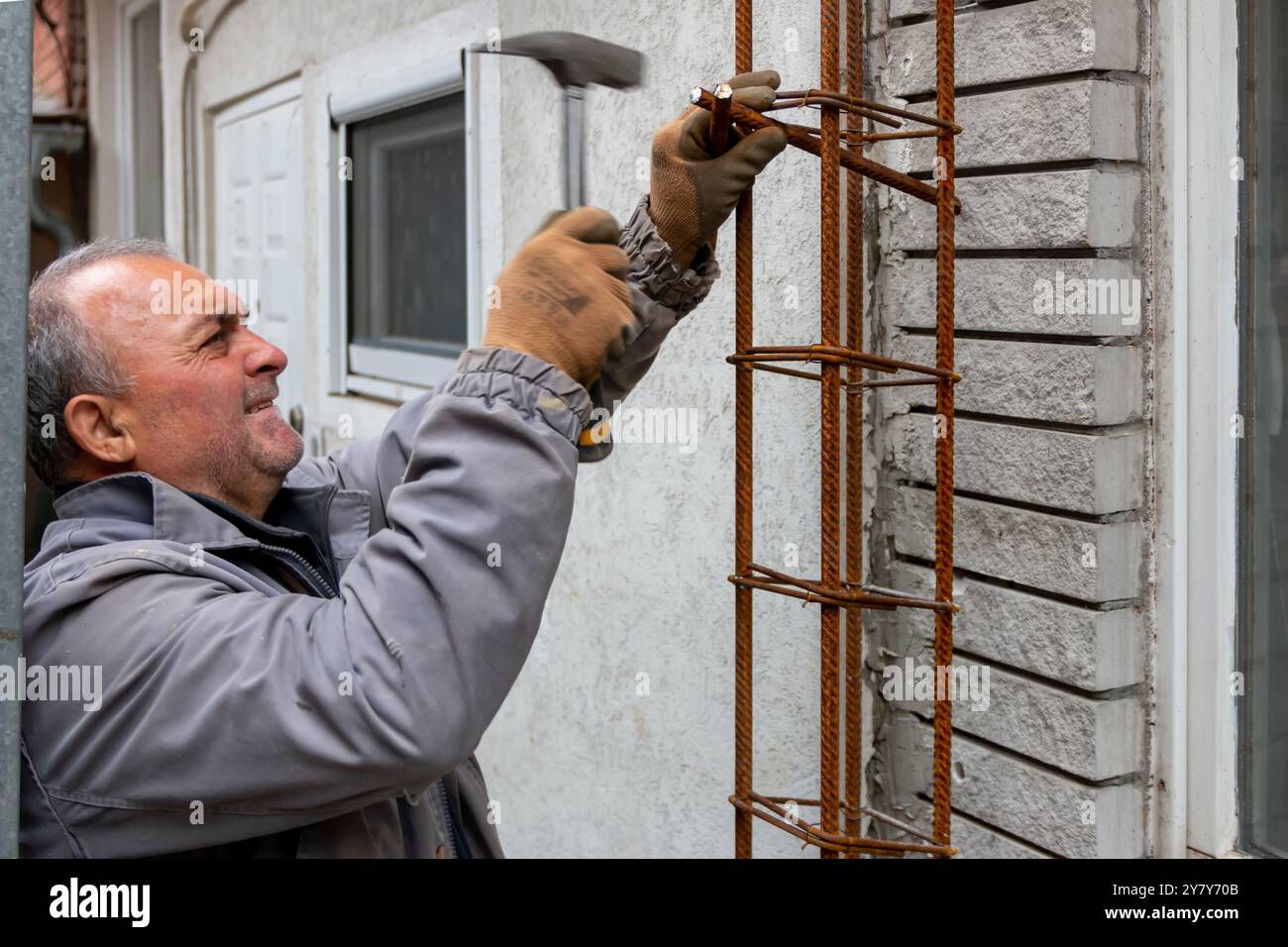 Worker is installing and assembling column formworks for concrete ...