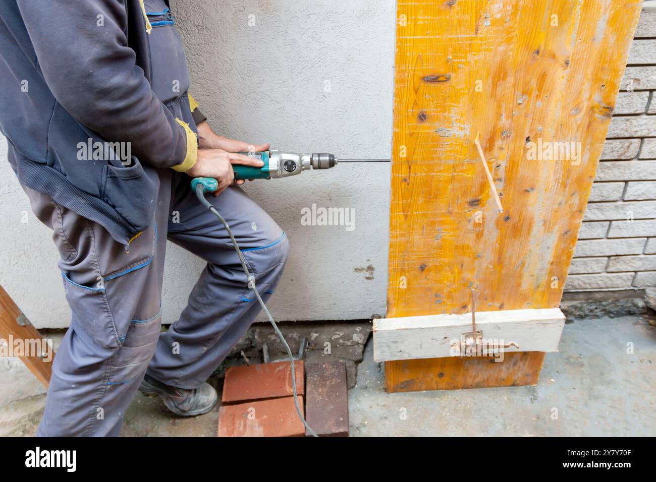 Worker is installing and assembling column formworks for concrete ...