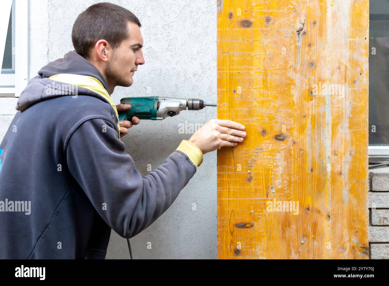 Worker is installing and assembling column formworks for concrete ...