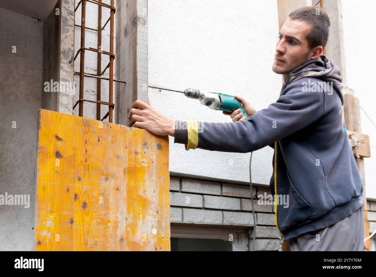 Worker is installing and assembling column formworks for concrete ...