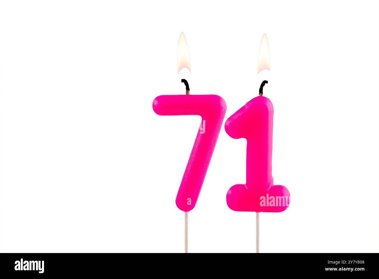 Pink number 71 birthday candle on white background Stock Photo - Alamy