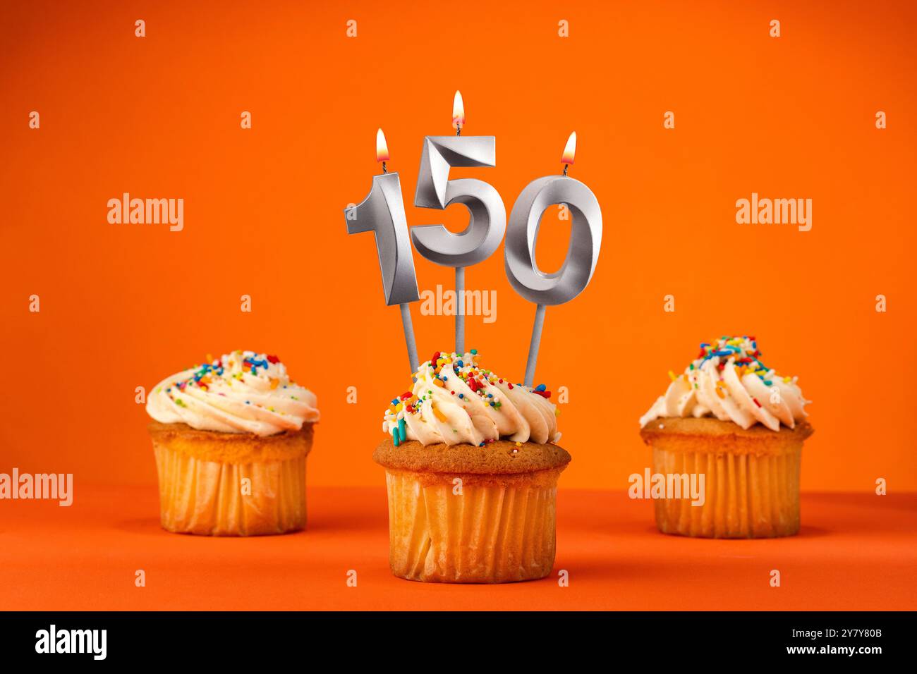Birthday celebration in orange color - Candle number 150 Stock Photo ...