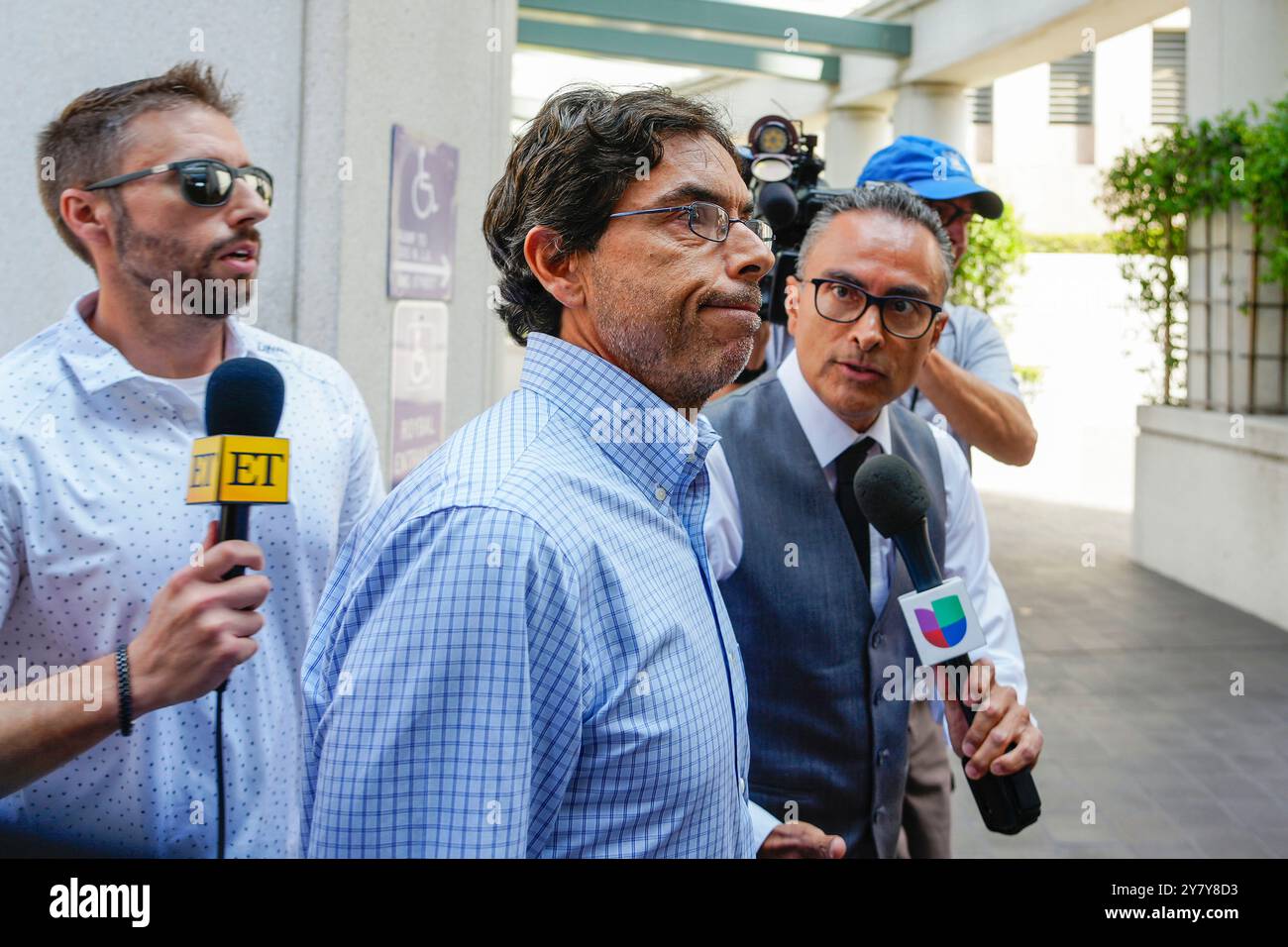 FILE - Dr. Mark Chavez, center, a physician from San Diego, who is ...