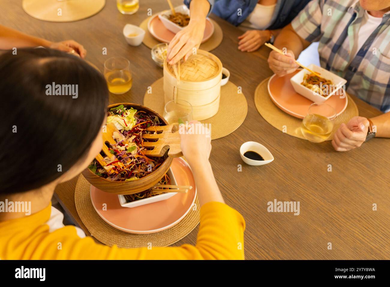 At home, Sharing Asian cuisine, asian family enjoying meal together at dining table Stock Photo ...
