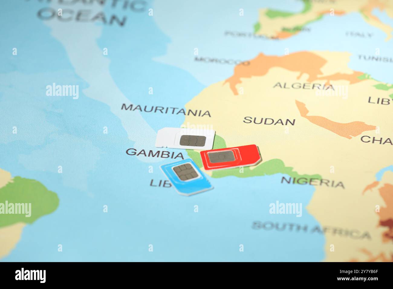 Modern SIM cards on world map, closeup Stock Photo - Alamy