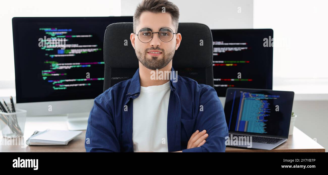 Programmer working at desk in office. Banner design Stock Photo - Alamy