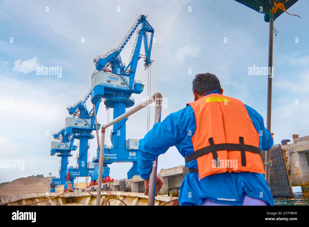 Chancay, Lima. Peru, September 20 2024:A man in a life vest stands on a ...