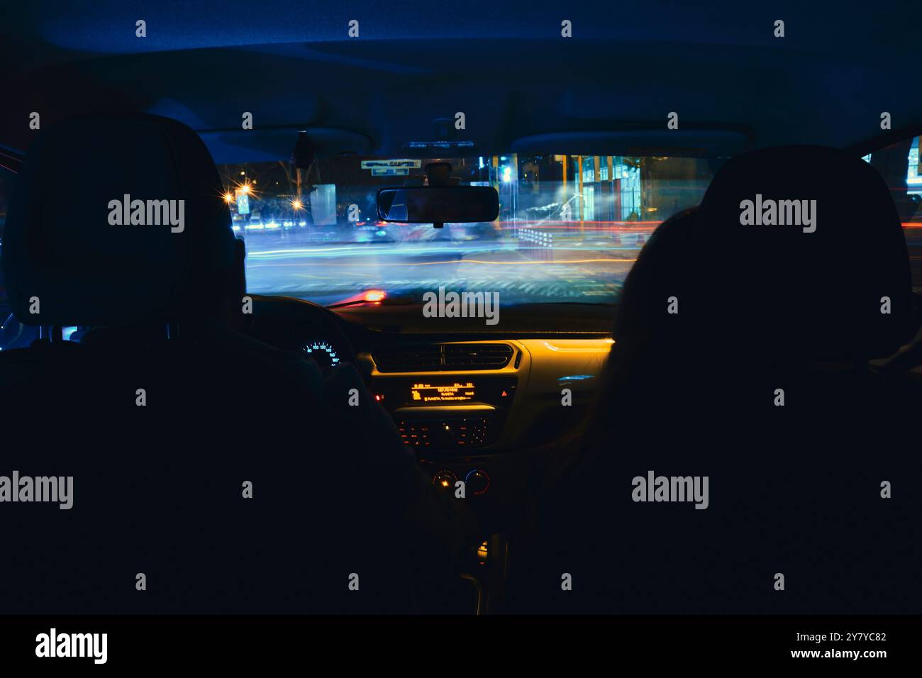 A couple is driving in a car at night, motion blur Stock Photo - Alamy