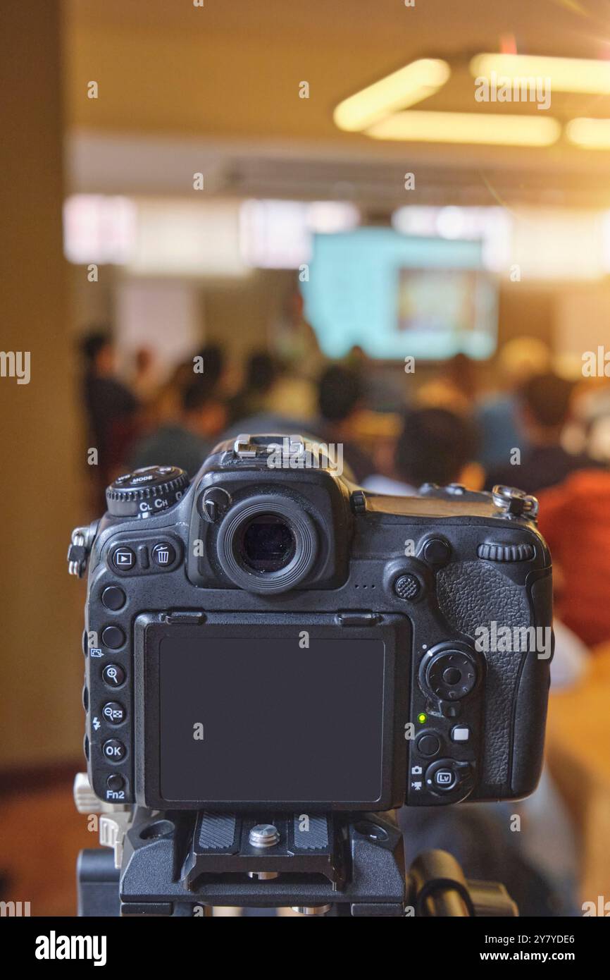 A camera is pointed at a group of people Stock Photo - Alamy