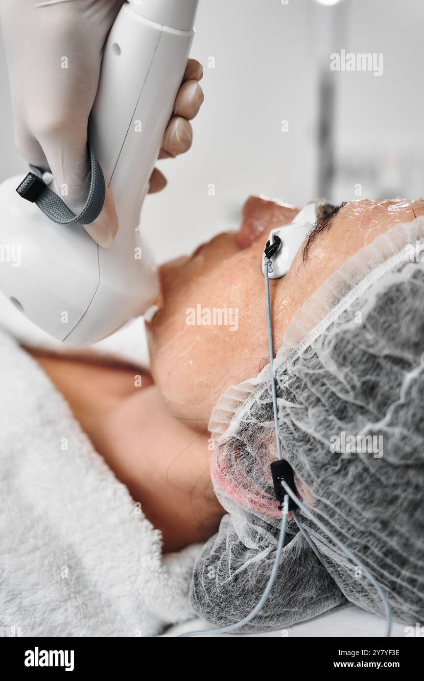 Aesthetic treatment session in a modern clinic during daytime Stock ...