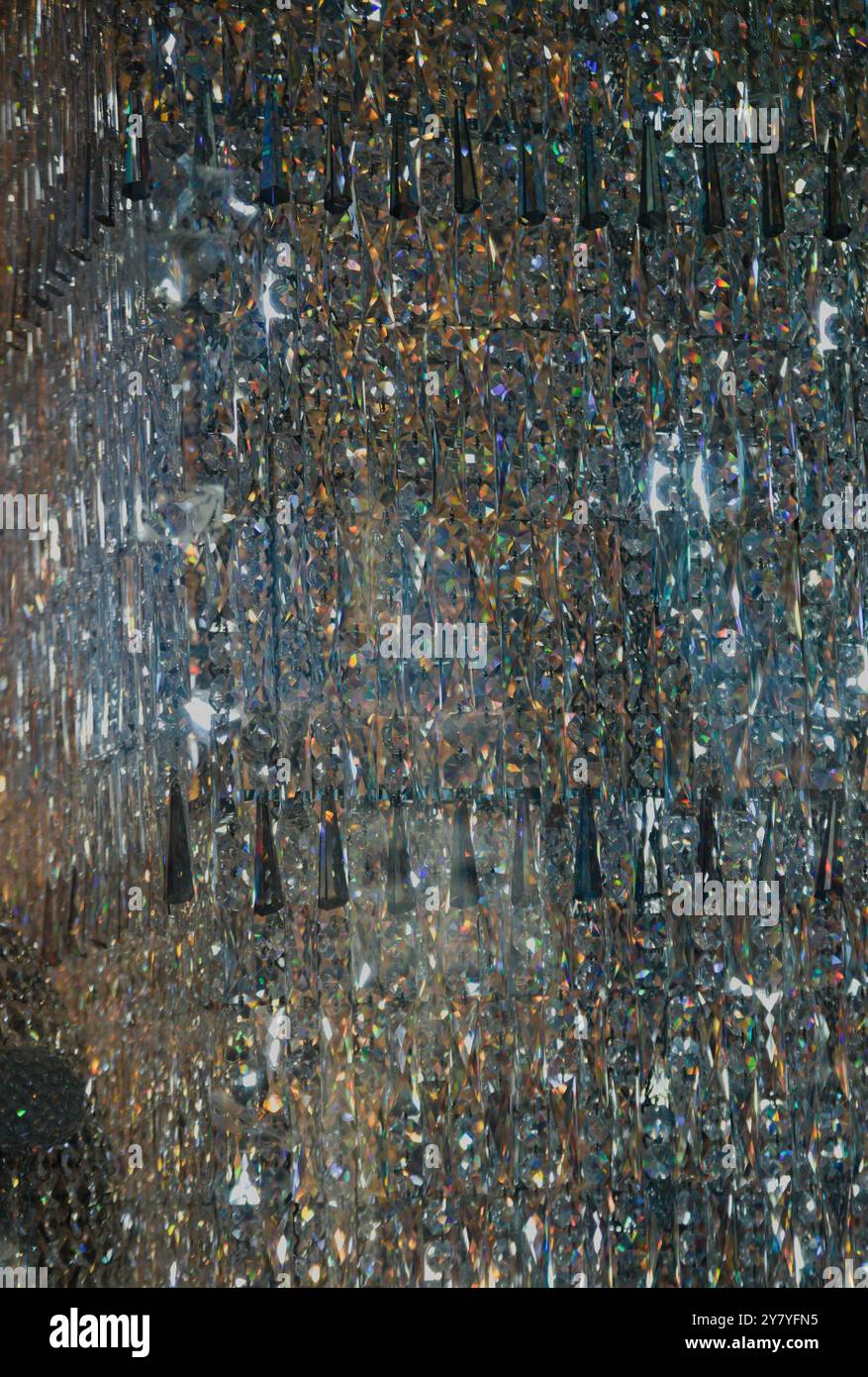 Abstract art of cut glass, reflecting light in a wide array of colors ...