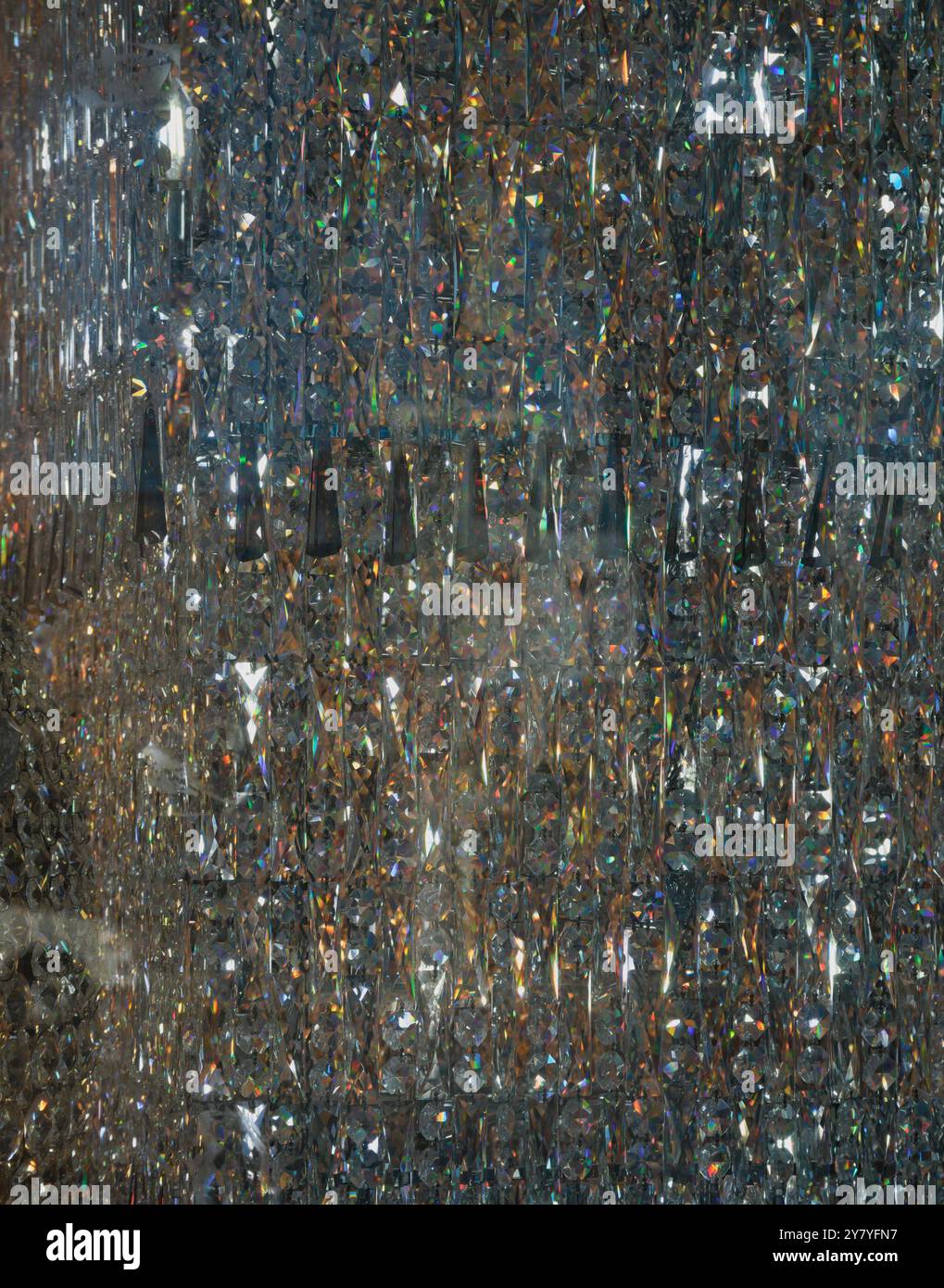 Abstract art of cut glass, reflecting light in a wide array of colors ...