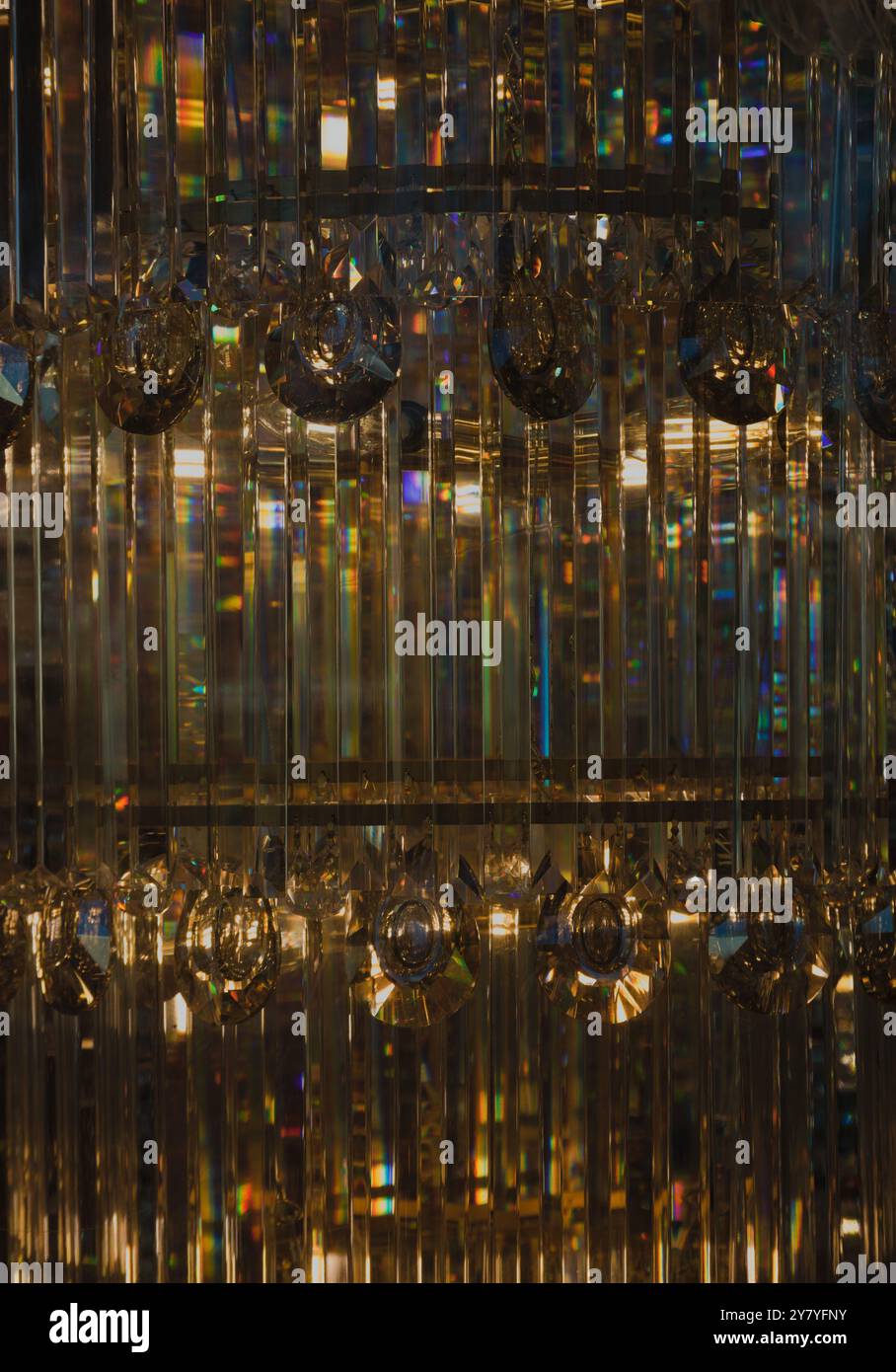 Abstract art of cut glass, reflecting light in a wide array of colors ...