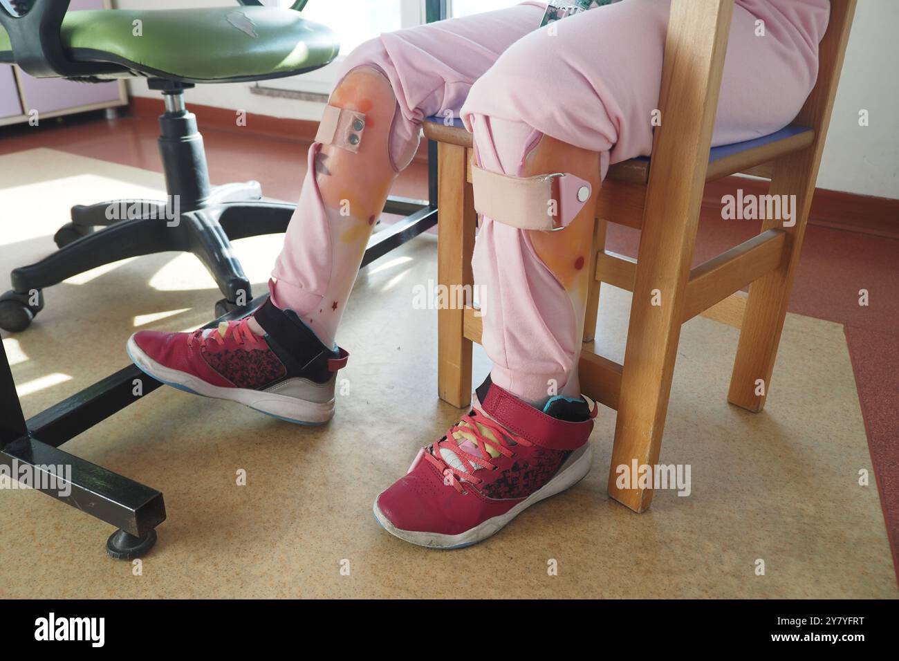 Child cerebral palsy disability, legs orthosis Stock Photo - Alamy