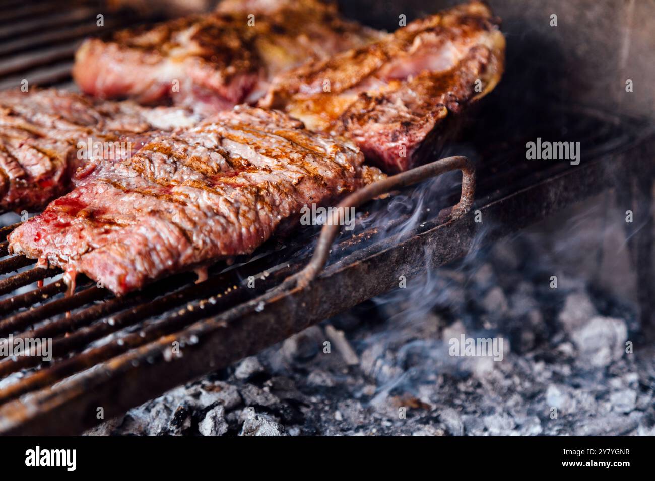 Roasted meat on the grill. Barbeque, bbq meat cooking. Traditional ...