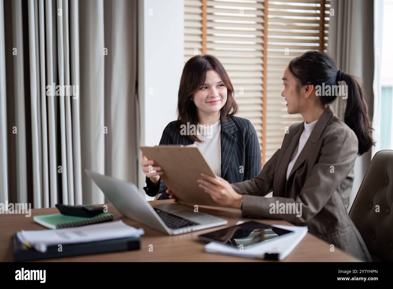 Female Financial Advisor Presenting Insights in a Corporate Meeting ...