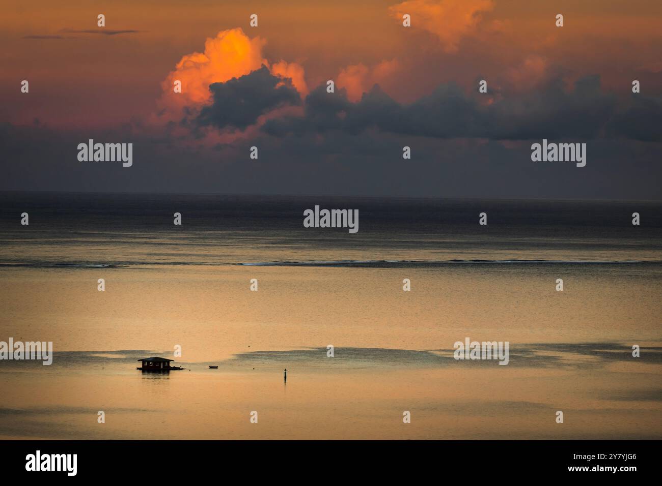 Sun setting over the barrier reef. Teahupoo. French Polynesia Stock ...
