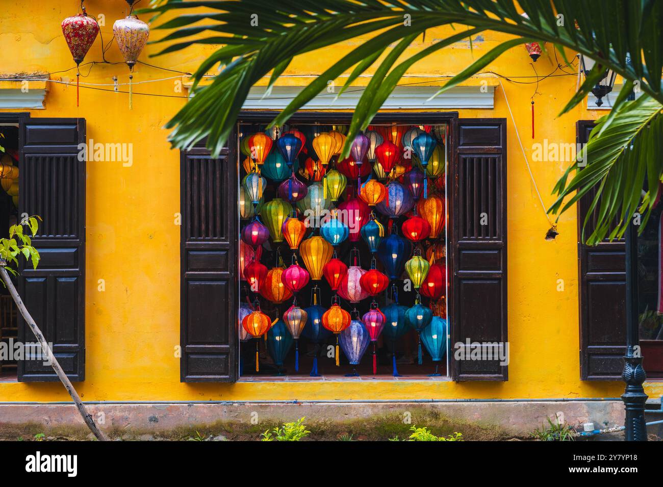 Colorful Chinese lanterns decorate the window of a traditional Asian ...