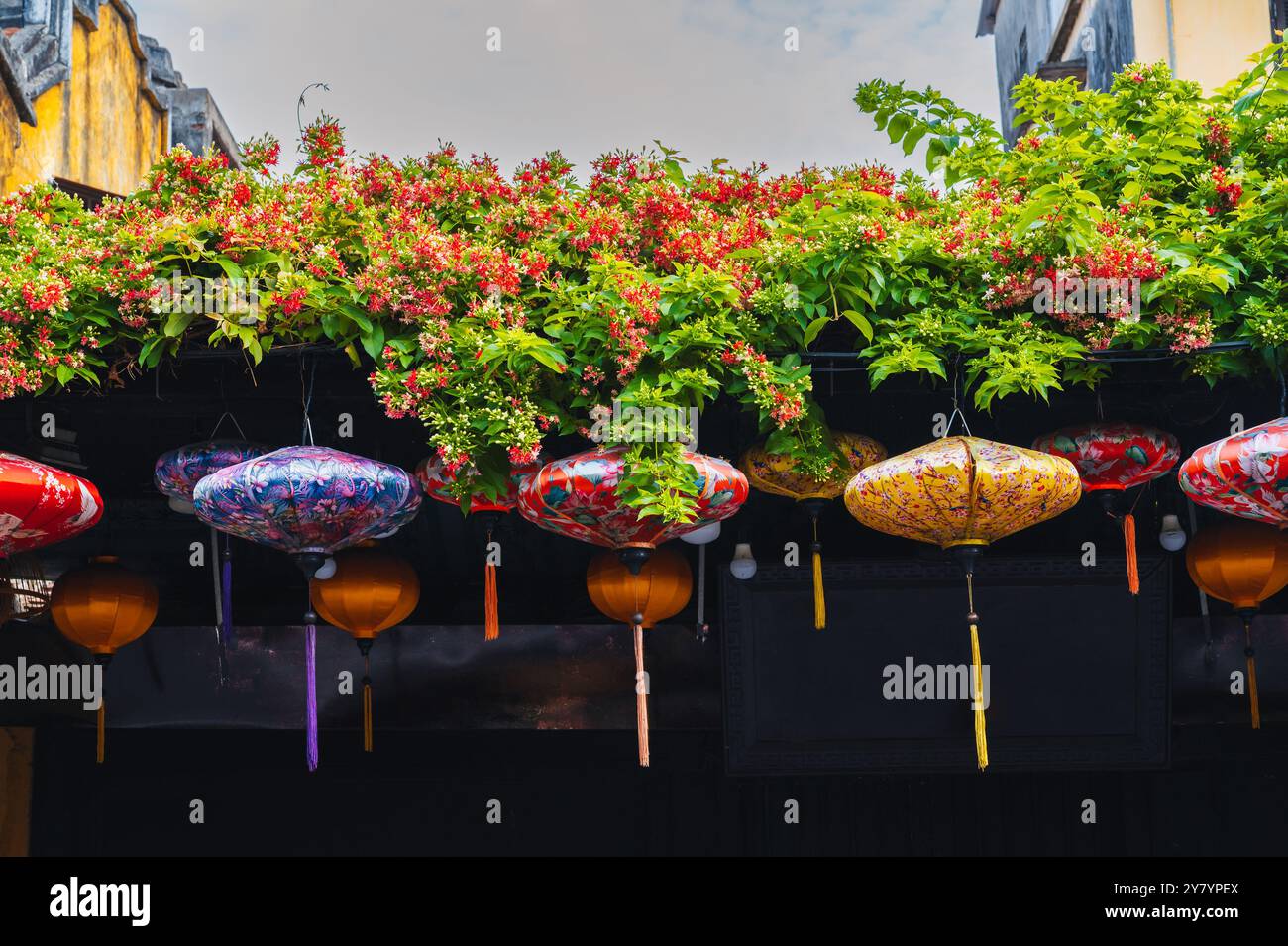 Colorful Chinese lanterns decorate the wall of a traditional Asian ...