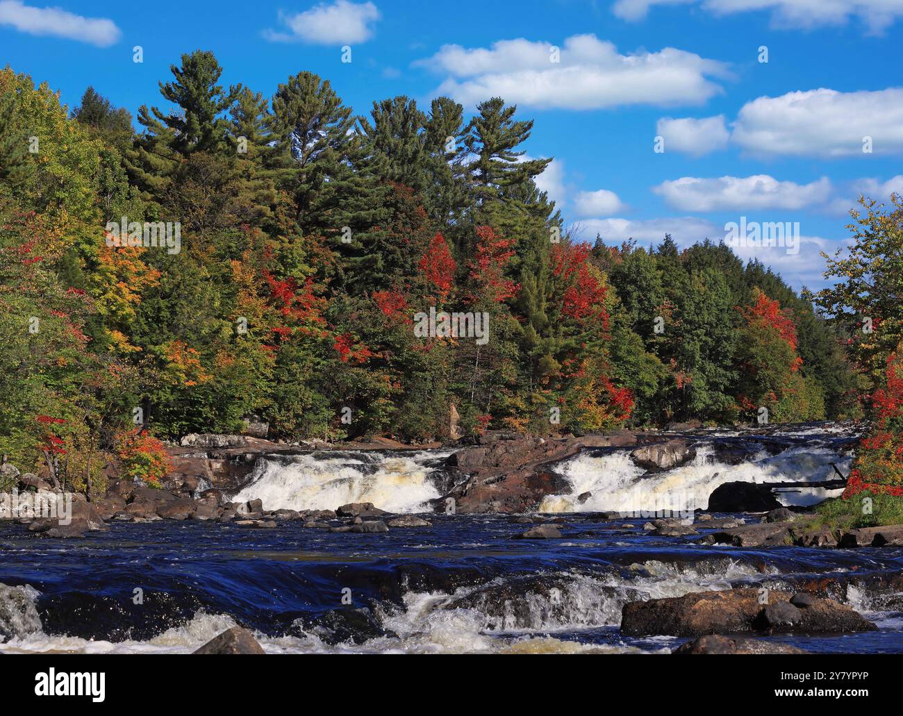 Wilson Falls, with autumn leaf color background in Saint Jerome, Quebec ...