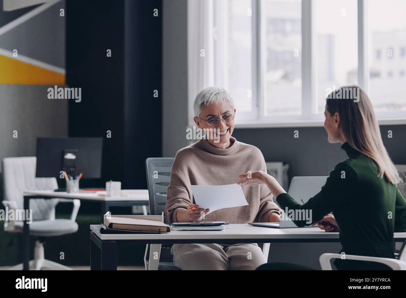 Happy female HR manager having interview with job candidate while ...