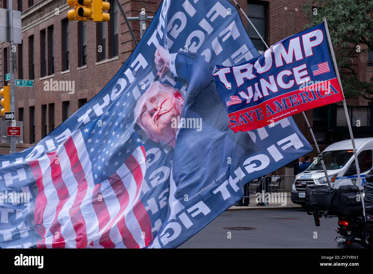 A giant Trump flag with a picture of Trump from the assisination ...