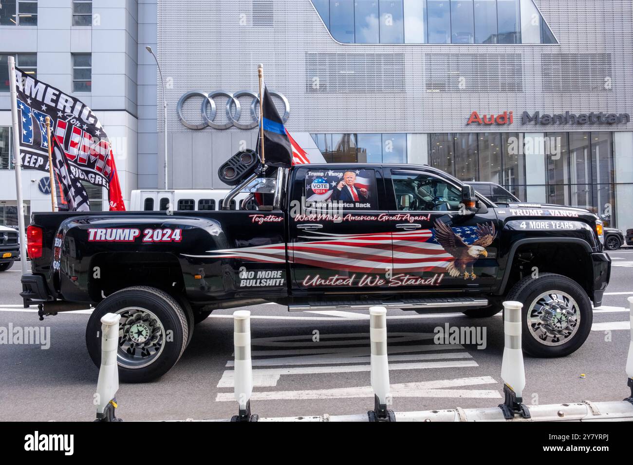 A truck decorated with Trump flags, Trump decals readng "4 more years ...