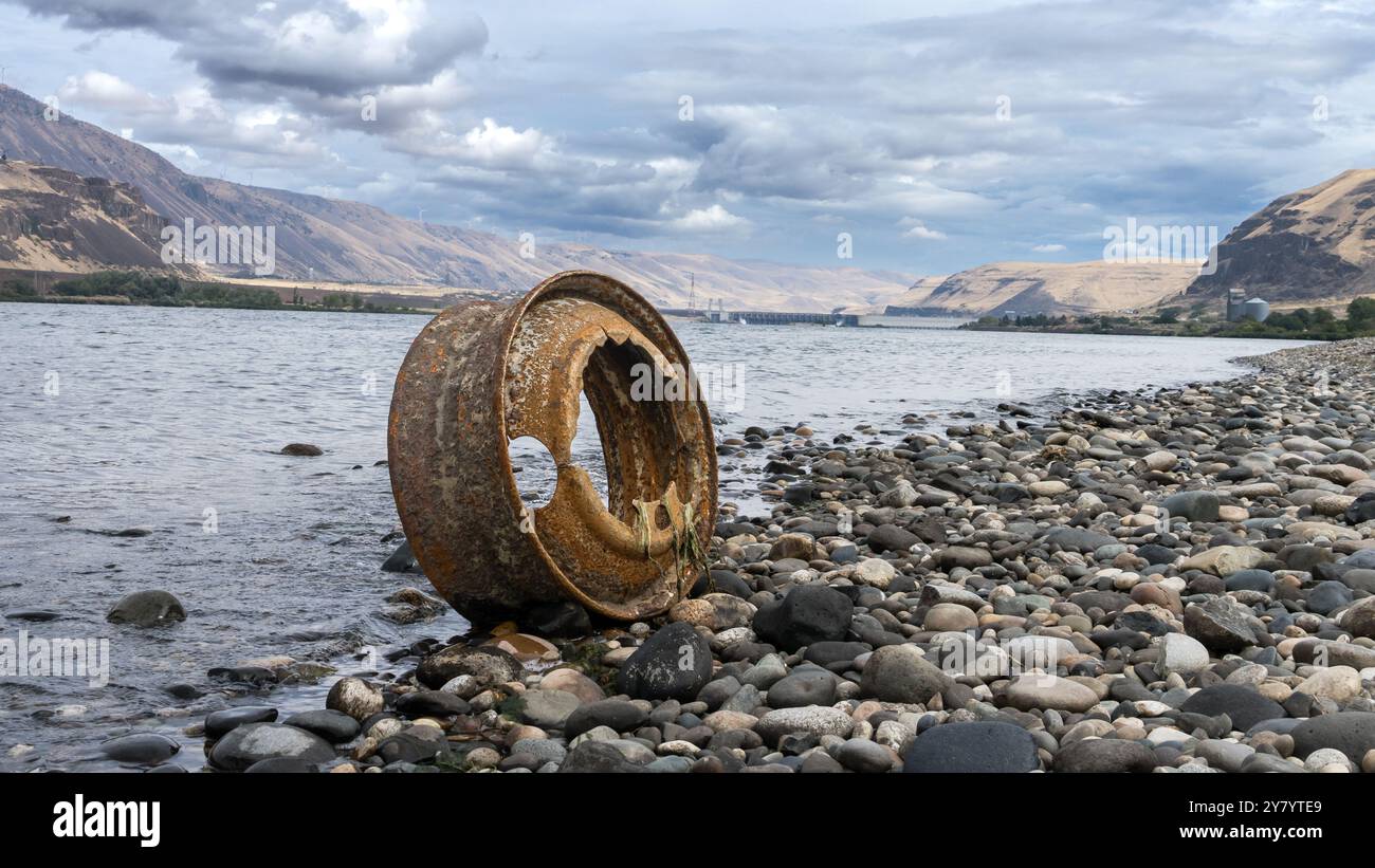 Abounded broken wheel rim on Columbia river bank as irresponsible ...