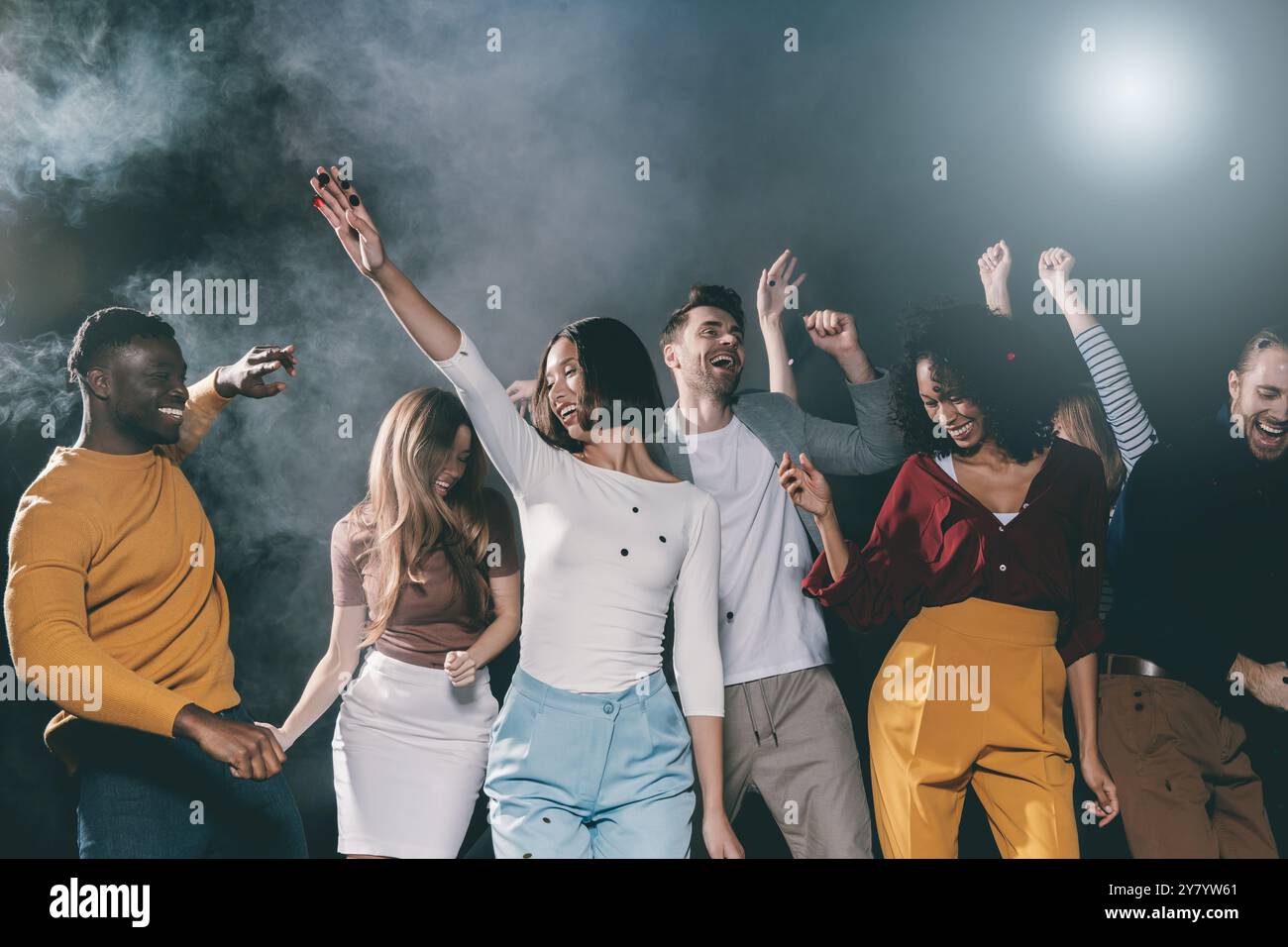 Group of happy young people dancing and having fun in the night club ...