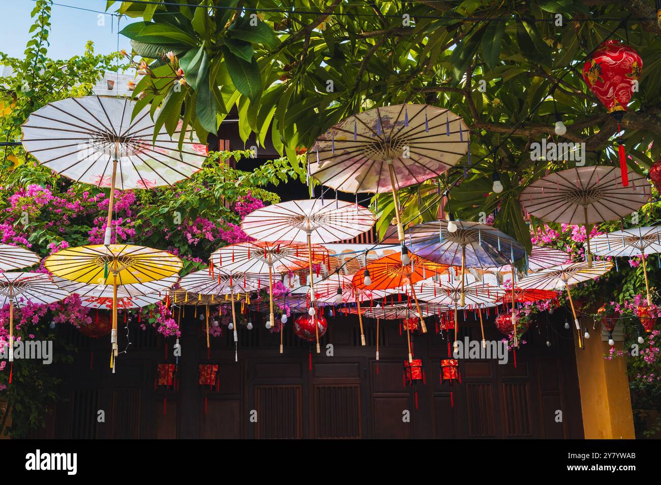 Colorful decorative Asian Japanese umbrellas decorate a street in Hoi ...