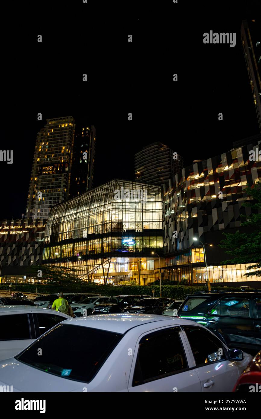 Modern Shopping Mall Facade at Night with City Lights Stock Photo - Alamy