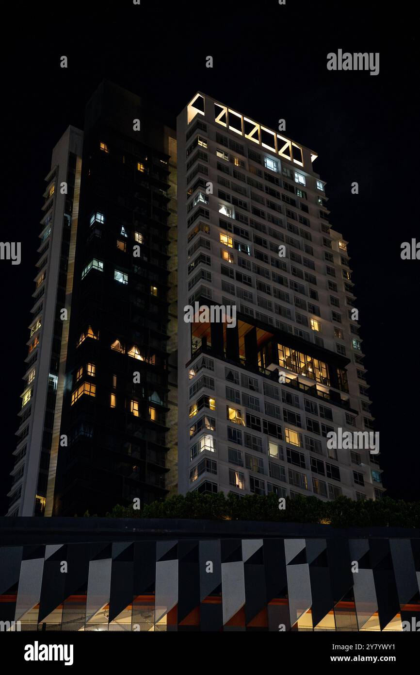 Modern Skyscraper Illuminated Against Night Sky with City Lights Stock ...
