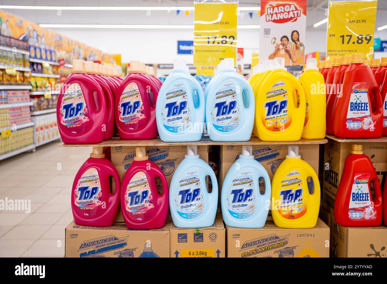 Multiple bottles of Breeze frontload detergent are neatly arranged on a ...