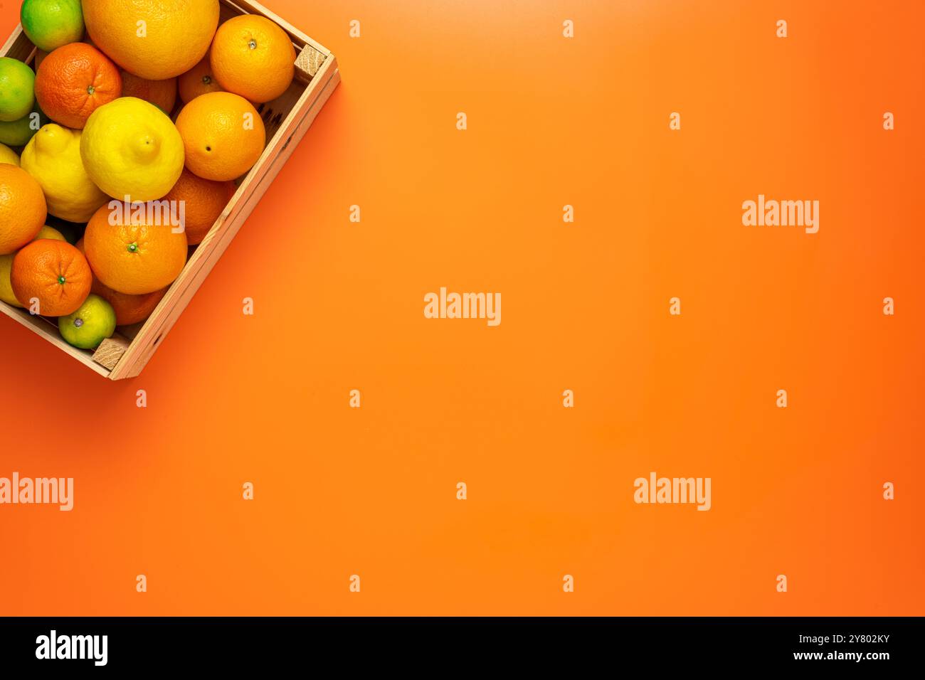 Concept for fresh, fruity and juicy fruit. Top view. A small wooden box ...