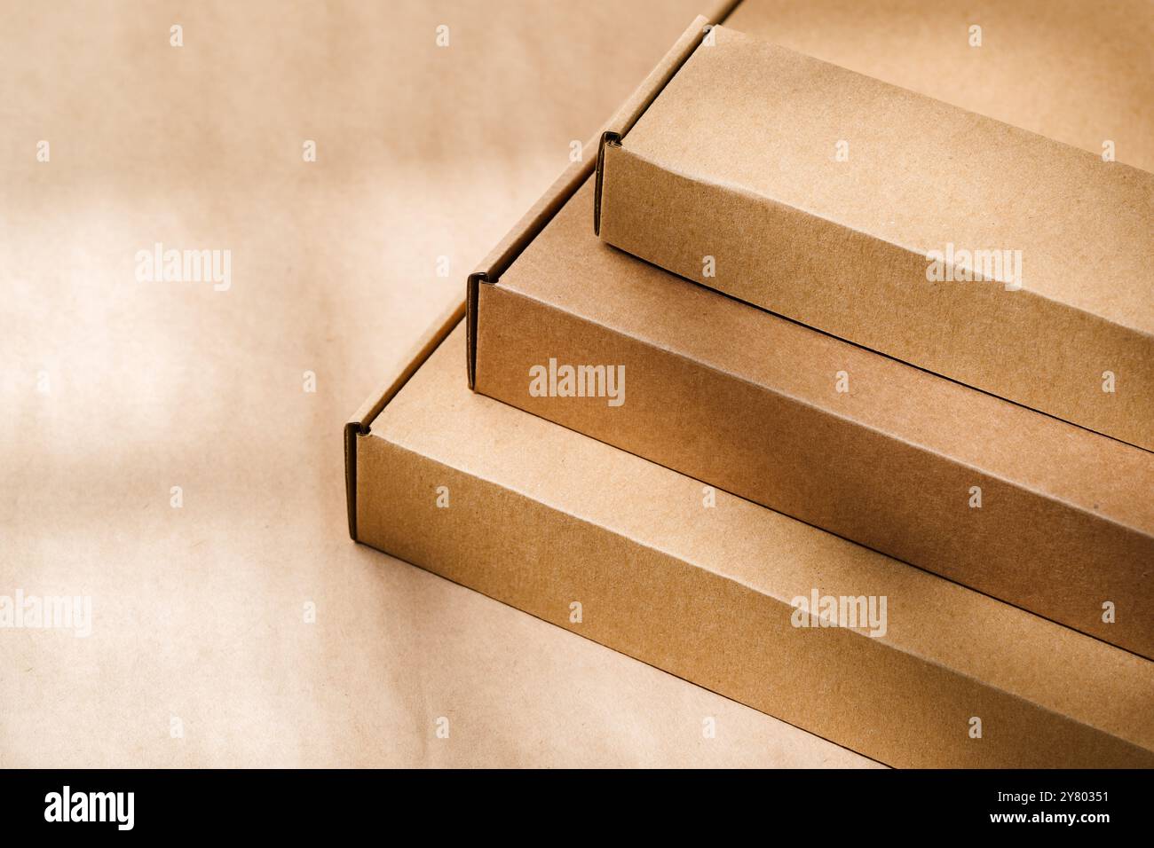 Stacked cardboard boxes on a neutral background in a shipping or ...