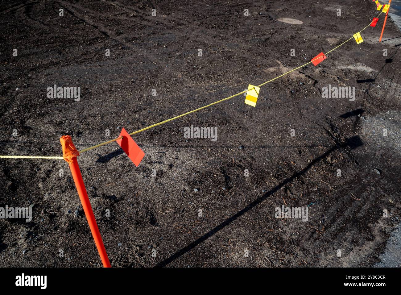 temporary red and yellow plastic fencing around mould area Stock Photo ...