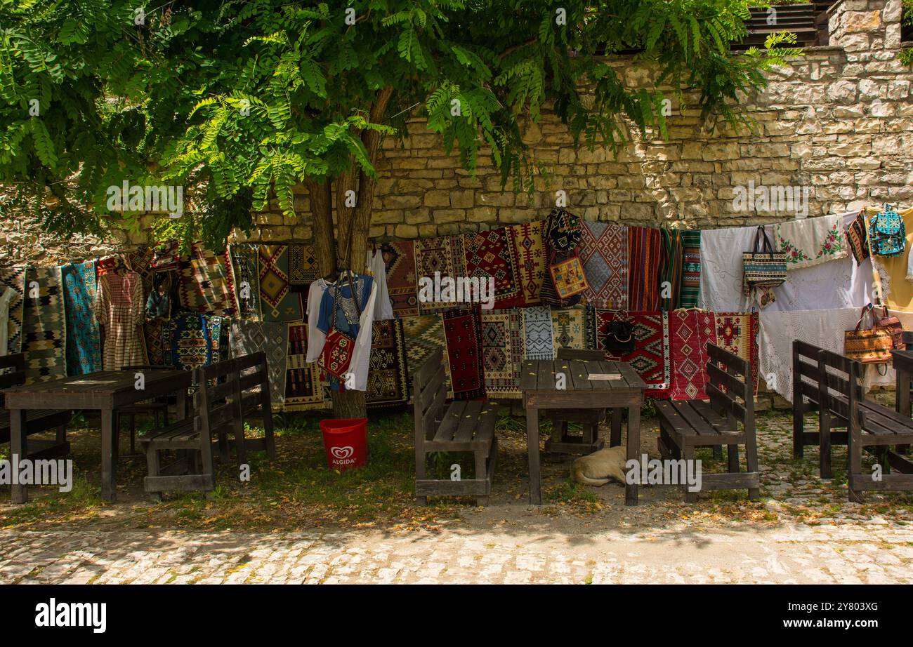 Berat, Albania - June 2nd 2024. Souvenir clothes, tablecloths and rugs ...