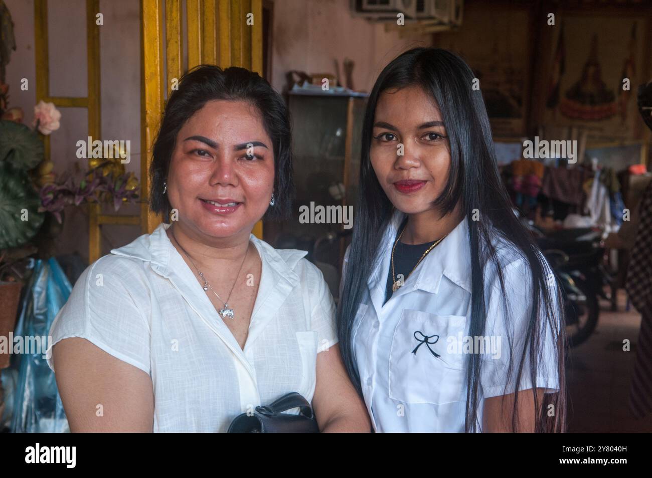 Portrait of two Cambodian women at a Buddhist ceremony during the Pchum ...