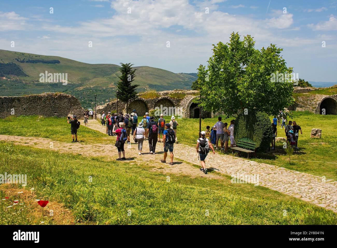Berat, Albania - June 2nd 2024. Visitors walk past vaulted arches in ...