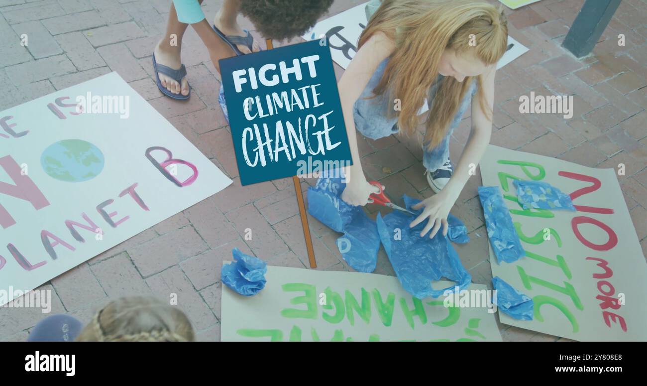 Image of fight climate change placard over diverse children making ...