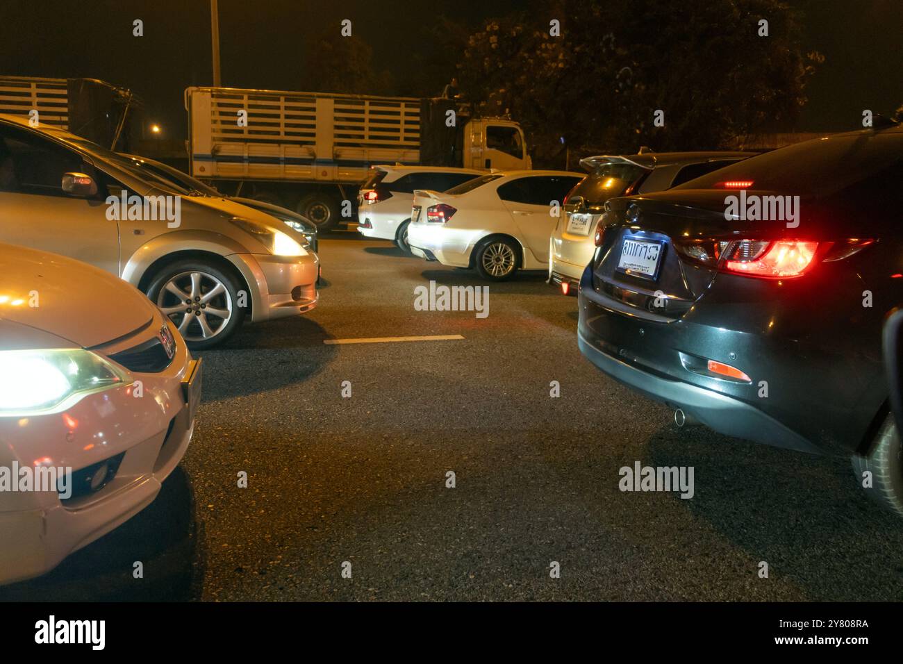 Convoys of cars in the night city Stock Photo - Alamy