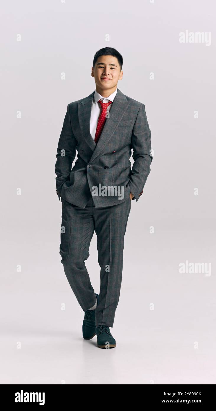 Full-length photo of young man dressed formal sui walking confidently ...