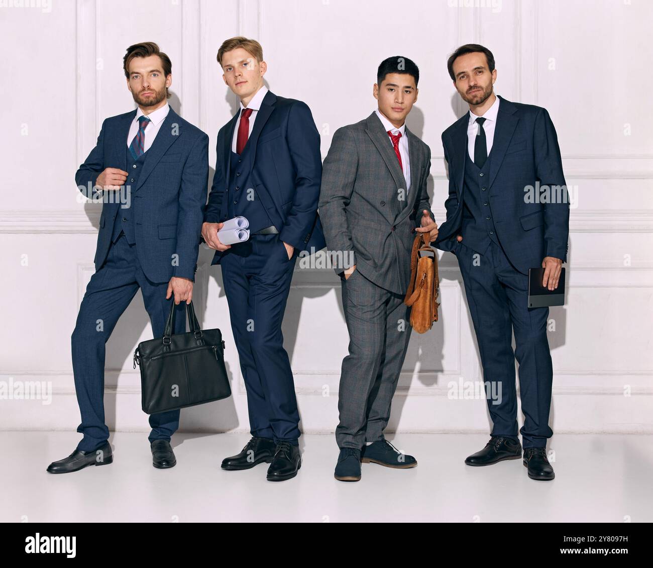 Formal group portrait, strong men presenting elegance and teamwork ...