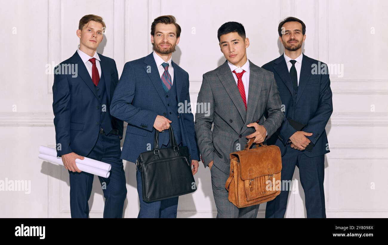 Businessmen hold important work materials, posing in formal attire and ...
