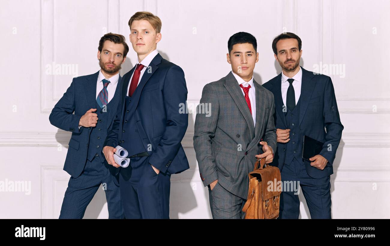 Formal group portrait, strong men presenting elegance and teamwork ...