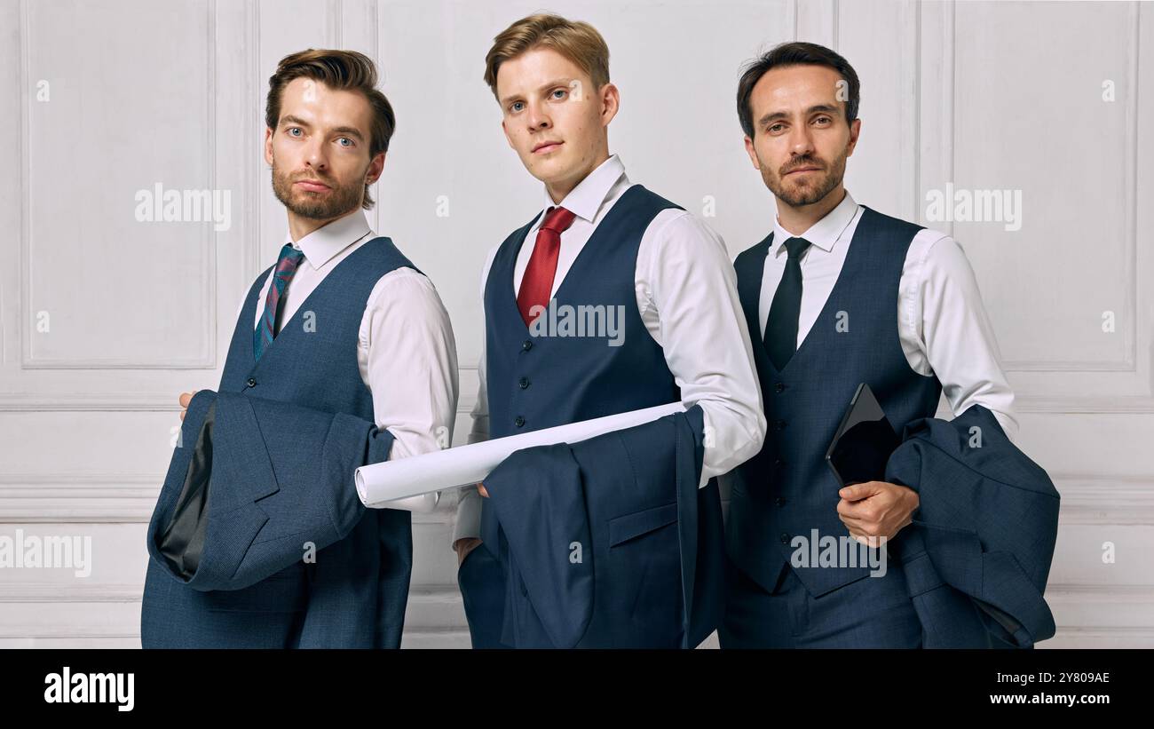 Discussing business after productive day. Young men dressed formal ...