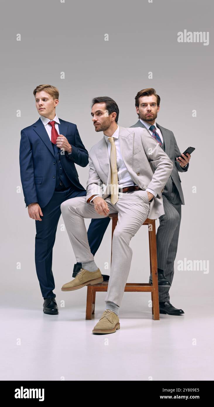 Professionals posed in business suits, showcasing authority and ...